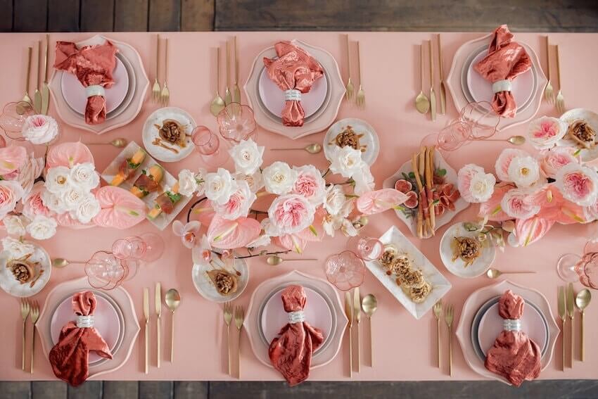 pink-themed-table-setting-with-flowers - STATIONERS